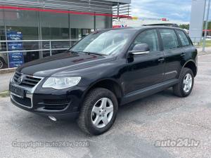 Black Volkswagen Touareg 2009 in Viljandi, with an engine capacity of 2.50 L and mileage of 220 thousand km for 7780 €, photo  on AUTOMOTO.COM.LV