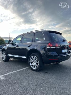 Black Volkswagen Touareg 2009 in Vilnius, with an engine capacity of 3.00 L and mileage of 259 thousand km for 7850 €, photo 5 on AUTOMOTO.COM.LV