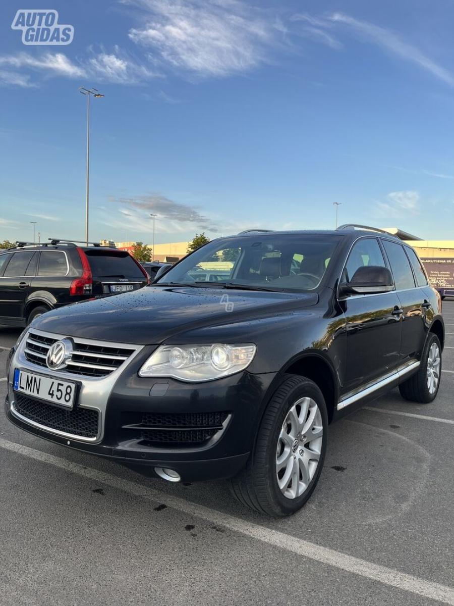 Black Volkswagen Touareg 2009 in Vilnius, with an engine capacity of 3.00 L and mileage of 259 thousand km for 7850 €, photo 20 on AUTOMOTO.COM.LV