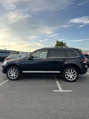 Black Volkswagen Touareg 2009 in Vilnius, with an engine capacity of 3.00 L and mileage of 259 thousand km for 7850 €, photo 22 on AUTOMOTO.COM.LV