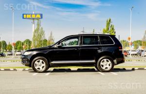 Black Volkswagen Touareg 2009 in Riga, with an engine capacity of 3.00 L and mileage of 383 thousand km for 5290 €, photo 5 on AUTOMOTO.COM.LV