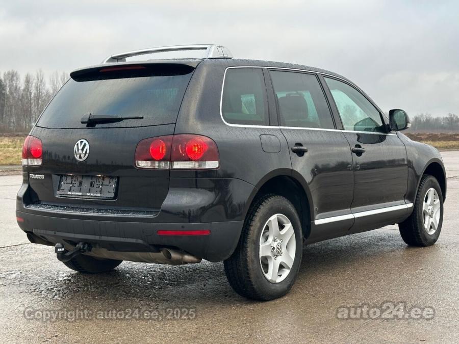 Melns Volkswagen Touareg 2010 Tartu, ar dzinēja tilpumu 3.00 L un nobraukumu 277 tūkst. km par 8950 €, foto 2 vietnē AUTOMOTO.COM.LV