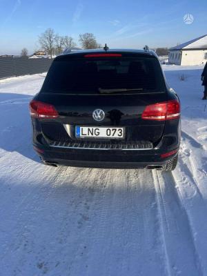 Black Volkswagen Touareg 2010 in Siauliai, with an engine capacity of 2.97 L and mileage of 280 thousand km for 10500 €, photo 6 on AUTOMOTO.COM.LV