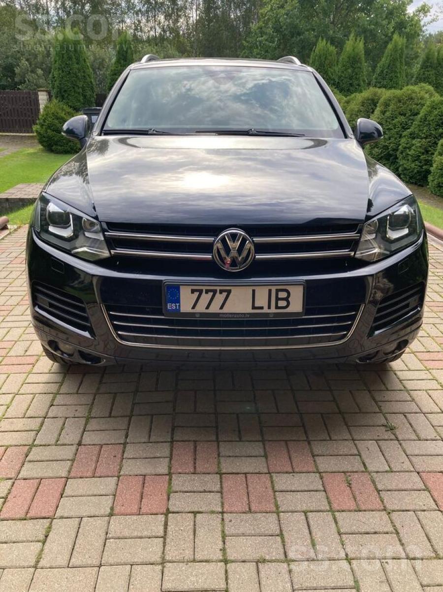 Melns Volkswagen Touareg 2010 Rīga, ar dzinēja tilpumu 3.00 L un nobraukumu 277 tūkst. km par 9500 €, foto 1 vietnē AUTOMOTO.COM.LV