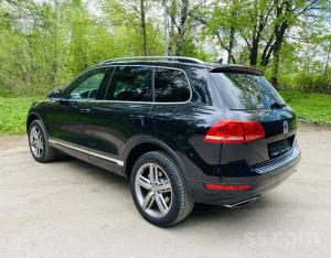 Black Volkswagen Touareg 2010 in Riga, with an engine capacity of 3.00 L and mileage of 0 thousand km for 10990 €, photo 6 on AUTOMOTO.COM.LV