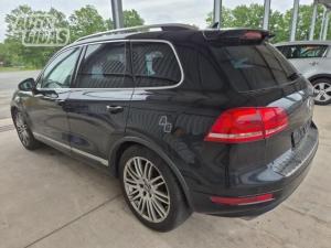 Black Volkswagen Touareg 2010 in Vilnius, with an engine capacity of 3.00 L and mileage of 221 thousand km for 7800 €, photo  on AUTOMOTO.COM.LV