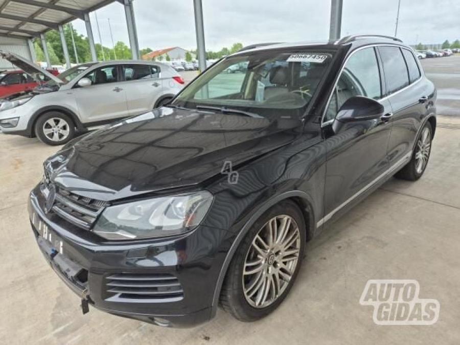 Black Volkswagen Touareg 2010 in Vilnius, with an engine capacity of 3.00 L and mileage of 221 thousand km for 7800 €, photo 5 on AUTOMOTO.COM.LV