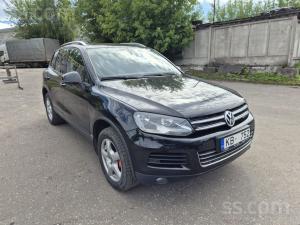 Black Volkswagen Touareg 2010 in Riga, with an engine capacity of 3.00 L and mileage of 265 thousand km for 8490 €, photo 3 on AUTOMOTO.COM.LV
