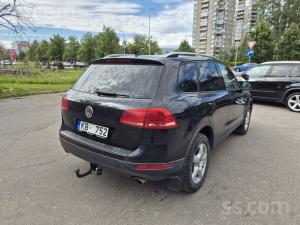 Black Volkswagen Touareg 2010 in Riga, with an engine capacity of 3.00 L and mileage of 265 thousand km for 8490 €, photo 7 on AUTOMOTO.COM.LV
