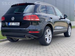 Black Volkswagen Touareg 2011 in Riga, with an engine capacity of 3.00 L and mileage of 218 thousand km for 12990 €, photo 9 on AUTOMOTO.COM.LV