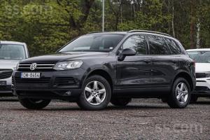 Black Volkswagen Touareg 2011 in Riga, with an engine capacity of 3.00 L and mileage of 295 thousand km for 11990 €, photo  on AUTOMOTO.COM.LV