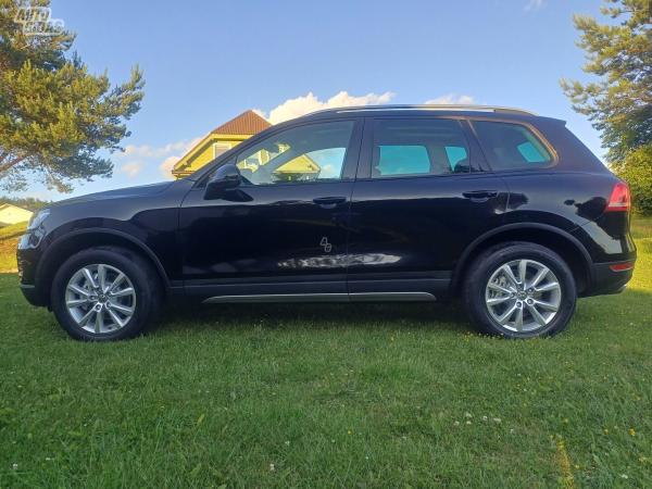 Melns Volkswagen Touareg 2011 Ignalina, ar dzinēja tilpumu 3.00 L un nobraukumu 300 tūkst. km par 11800 €, foto 7 vietnē AUTOMOTO.COM.LV