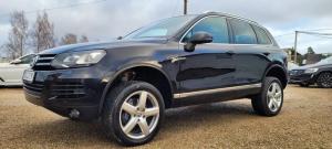 Black Volkswagen Touareg 2011 in Riga, with an engine capacity of 3.00 L and mileage of 304 thousand km for 11900 €, photo  on AUTOMOTO.COM.LV