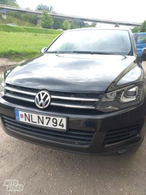 Black Volkswagen Touareg 2011 in Vilnius, with an engine capacity of 3.00 L and mileage of 306 thousand km for 9700 €, photo  on AUTOMOTO.COM.LV