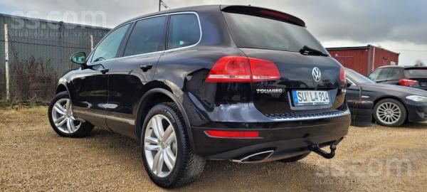 Black Volkswagen Touareg 2012 in Riga, with an engine capacity of 3.00 L and mileage of 0 thousand km for 12500 €, photo 3 on AUTOMOTO.COM.LV