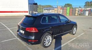 Black Volkswagen Touareg 2012 in Riga, with an engine capacity of 3.00 L and mileage of 282 thousand km for 11400 €, photo 4 on AUTOMOTO.COM.LV