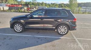Black Volkswagen Touareg 2012 in Riga, with an engine capacity of 3.00 L and mileage of 282 thousand km for 11400 €, photo 5 on AUTOMOTO.COM.LV