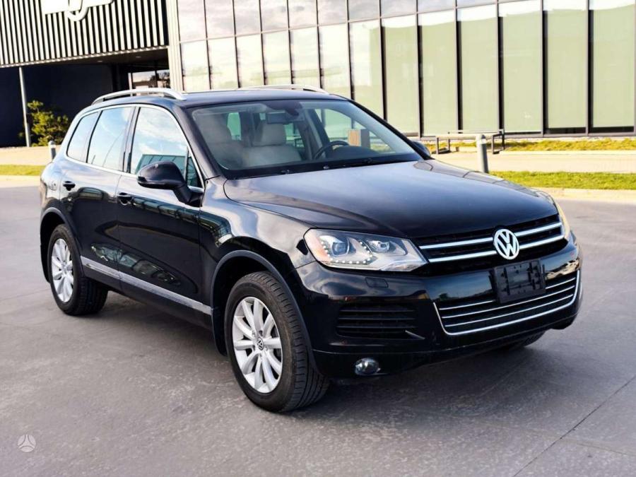 Black Volkswagen Touareg 2012 in Siauliai, with an engine capacity of 3.60 L and mileage of 180 thousand km for 8700 €, photo 1 on AUTOMOTO.COM.LV