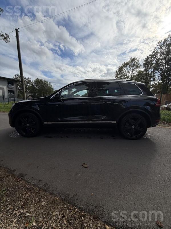 Melns Volkswagen Touareg 2012 Rīga, ar dzinēja tilpumu 3.00 L un nobraukumu 308 tūkst. km par 11850 €, foto 6 vietnē AUTOMOTO.COM.LV