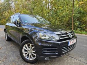 Black Volkswagen Touareg 2012 in Riga, with an engine capacity of 3.00 L and mileage of 250 thousand km for 11250 €, photo 3 on AUTOMOTO.COM.LV