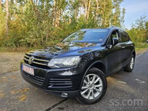 Black Volkswagen Touareg 2012 in Riga, with an engine capacity of 3.00 L and mileage of 250 thousand km for 11250 €, photo 9 on AUTOMOTO.COM.LV
