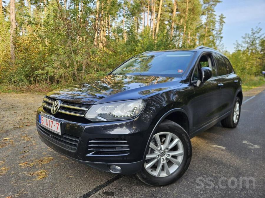 Black Volkswagen Touareg 2012 in Riga, with an engine capacity of 3.00 L and mileage of 250 thousand km for 11250 €, photo 9 on AUTOMOTO.COM.LV