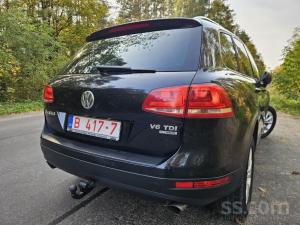 Black Volkswagen Touareg 2012 in Riga, with an engine capacity of 3.00 L and mileage of 250 thousand km for 11250 €, photo 11 on AUTOMOTO.COM.LV