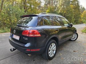 Black Volkswagen Touareg 2012 in Riga, with an engine capacity of 3.00 L and mileage of 250 thousand km for 11250 €, photo 12 on AUTOMOTO.COM.LV