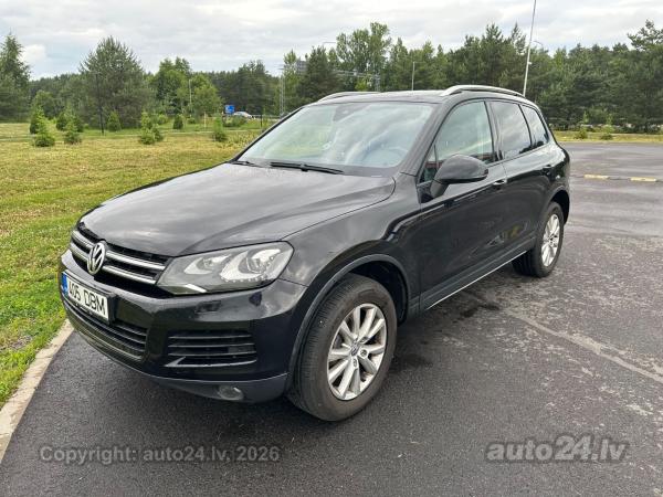 Melns Volkswagen Touareg 2013 Tallina, ar dzinēja tilpumu 3.00 L un nobraukumu 282 tūkst. km par 10999 €, foto 1 vietnē AUTOMOTO.COM.LV