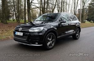 Black Volkswagen Touareg 2014 in Tartu, with an engine capacity of 3.00 L and mileage of 284 thousand km for 10999 €, photo 4 on AUTOMOTO.COM.LV
