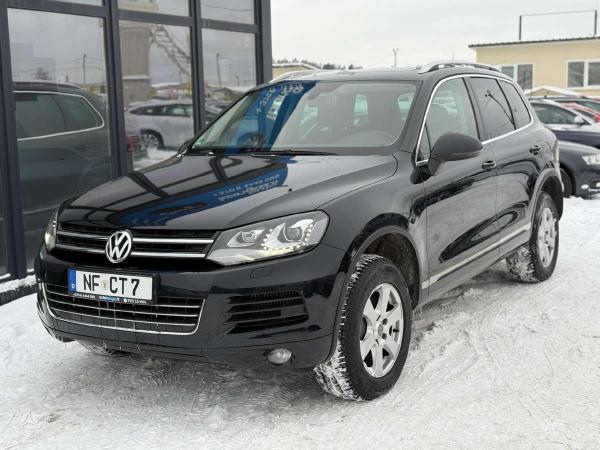 Black Volkswagen Touareg 2014 in Vilnius, with an engine capacity of 3.00 L and mileage of 206 thousand km for 12450 €, photo 1 on AUTOMOTO.COM.LV