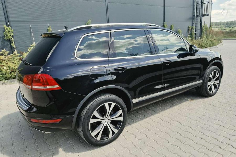 Black Volkswagen Touareg 2014 in Vilnius, with an engine capacity of 2.97 L and mileage of 203 thousand km for 14950 €, photo 14 on AUTOMOTO.COM.LV