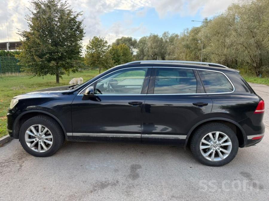 Black Volkswagen Touareg 2015 in Riga, with an engine capacity of 3.00 L and mileage of 204 thousand km for 11500 €, photo 6 on AUTOMOTO.COM.LV