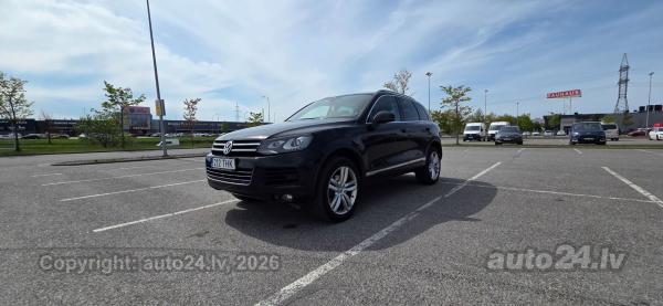 Black Volkswagen Touareg 2012 in Tallinn, with an engine capacity of 3.00 L and mileage of 331 thousand km for 10499 €, photo 3 on AUTOMOTO.COM.LV