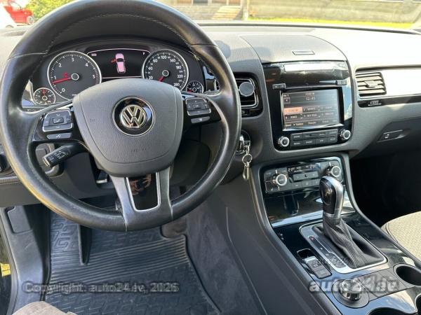 Black Volkswagen Touareg 2014 in Viljandi, with an engine capacity of 3.00 L and mileage of 498 thousand km for 10000 €, photo 6 on AUTOMOTO.COM.LV