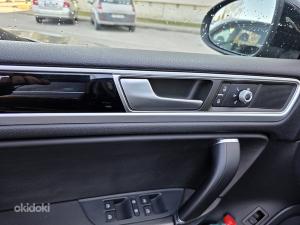 Black Volkswagen Touareg 2015 in Tallinn, with an engine capacity of 3.00 L and mileage of 128 thousand km for 19500 €, photo 4 on AUTOMOTO.COM.LV