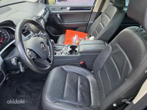 Black Volkswagen Touareg 2015 in Tallinn, with an engine capacity of 3.00 L and mileage of 128 thousand km for 19500 €, photo 5 on AUTOMOTO.COM.LV