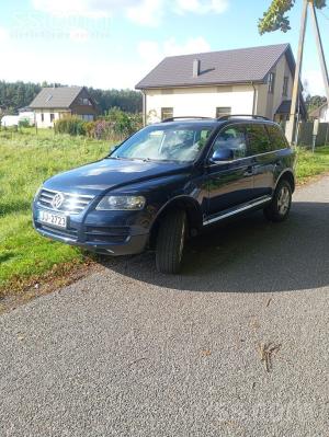 Blue Volkswagen Touareg 2006 in Riga, with an engine capacity of 2.50 L and mileage of 386 thousand km for 4100 €, photo 4 on AUTOMOTO.COM.LV