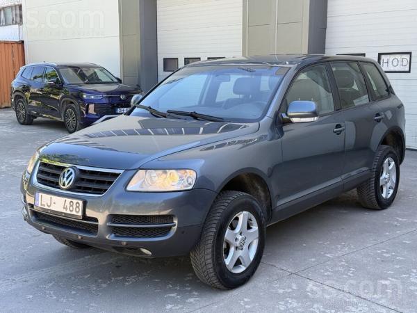 Blue Volkswagen Touareg 2006 in Riga, with an engine capacity of 2.50 L and mileage of 299 thousand km for 2890 €, photo 3 on AUTOMOTO.COM.LV