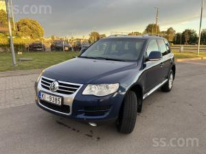 Blue Volkswagen Touareg 2009 in Riga, with an engine capacity of 3.00 L and mileage of 365 thousand km for 3900 €, photo  on AUTOMOTO.COM.LV