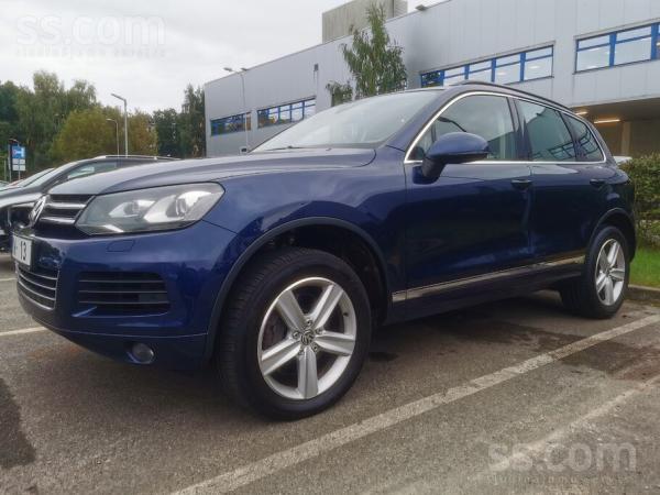 Blue Volkswagen Touareg 2010 in Riga, with an engine capacity of 4.20 L and mileage of 439 thousand km for 13950 €, photo 1 on AUTOMOTO.COM.LV