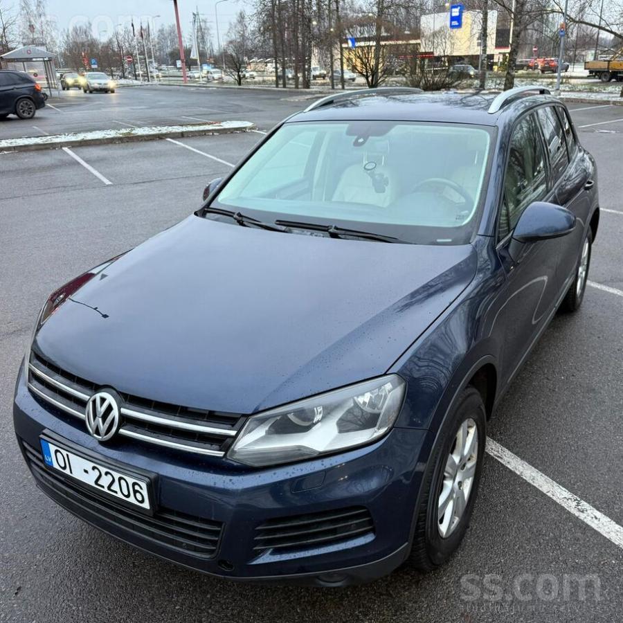 Blue Volkswagen Touareg 2012 in Riga, with an engine capacity of 3.00 L and mileage of 400 thousand km for 9800 €, photo 6 on AUTOMOTO.COM.LV