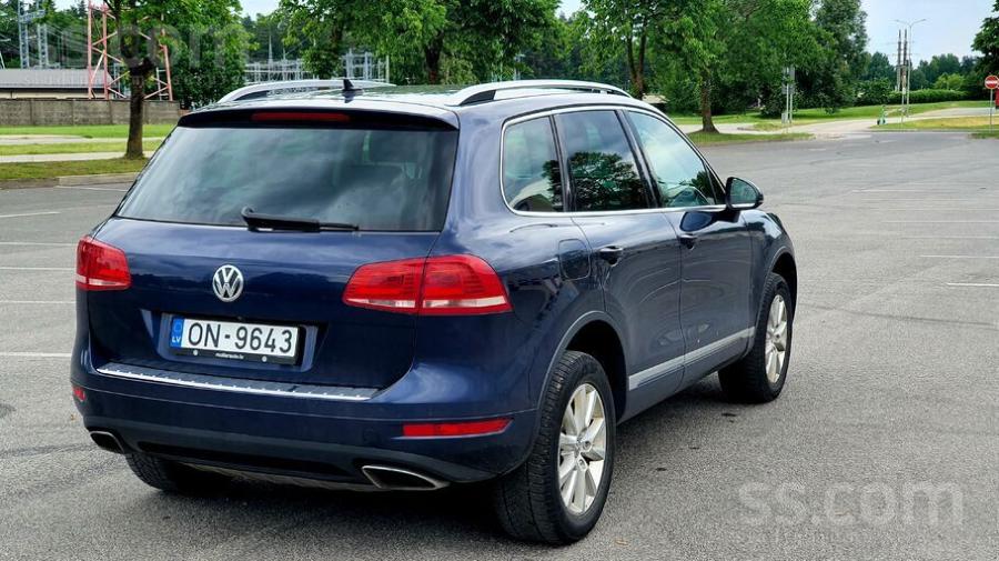 Blue Volkswagen Touareg 2013 in Riga, with an engine capacity of 3.00 L and mileage of 269 thousand km for 10900 €, photo 6 on AUTOMOTO.COM.LV