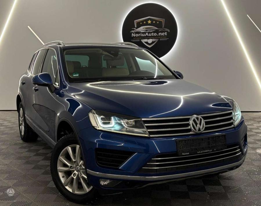 Blue Volkswagen Touareg 2016 in Marijampole, with an engine capacity of 2.97 L and mileage of 305 thousand km for 15450 €, photo 1 on AUTOMOTO.COM.LV