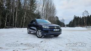 Blue Volkswagen Touareg 2013 in Tallinn, with an engine capacity of 3.00 L and mileage of 285 thousand km for 11990 €, photo 5 on AUTOMOTO.COM.LV