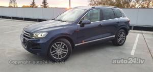 Blue Volkswagen Touareg 2013 in Tallinn, with an engine capacity of 3.00 L and mileage of 285 thousand km for 11990 €, photo 7 on AUTOMOTO.COM.LV