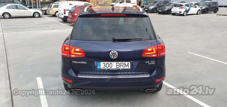 Blue Volkswagen Touareg 2013 in Tallinn, with an engine capacity of 3.00 L and mileage of 285 thousand km for 11990 €, photo 12 on AUTOMOTO.COM.LV