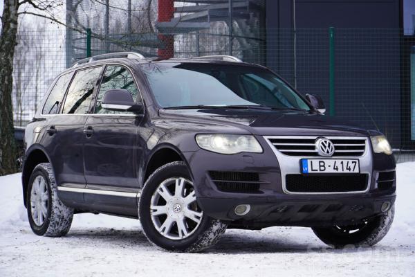 Brown Volkswagen Touareg 2008 in Riga, with an engine capacity of 3.00 L and mileage of 410 thousand km for 4990 €, photo 1 on AUTOMOTO.COM.LV