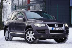 Brown Volkswagen Touareg 2008 in Riga, with an engine capacity of 3.00 L and mileage of 410 thousand km for 4990 €, photo  on AUTOMOTO.COM.LV