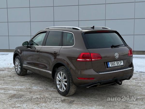 Brown Volkswagen Touareg 2010 in Tartu, with an engine capacity of 3.00 L and mileage of 239 thousand km for 9500 €, photo 4 on AUTOMOTO.COM.LV